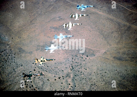 AN air-to-air overhead view of a seven-ship echelon formation of F-5E ...