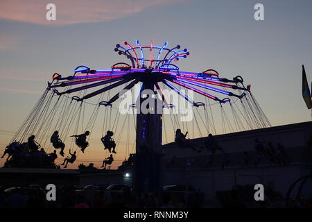 Spinning Swings at Amusement Park Stock Photo - Alamy