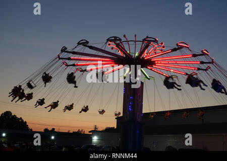 Spinning Swings at Amusement Park Stock Photo - Alamy