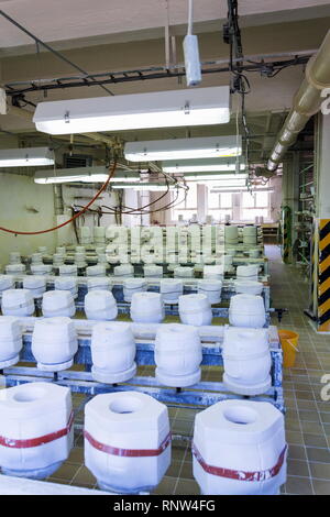 ceramic molding workshop production line in a factory, closeup of photo ...