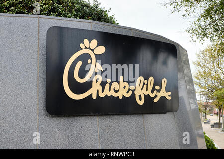 A logo sign outside of a Chick-fil-A fast food restaurant location in ...