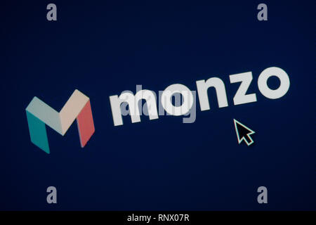 Monzo logo and website seen on phone and a computer screen Stock Photo ...