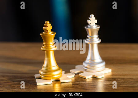 Chess pieces and puzzles, teamwork Stock Photo - Alamy