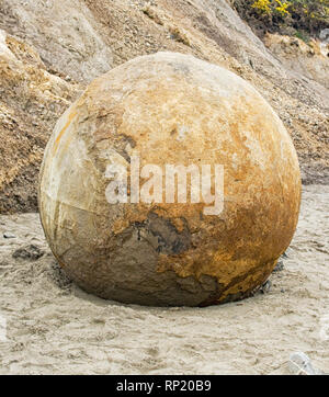 Closeup of a big boulder at the beach in Numana, Italy with the bright ...