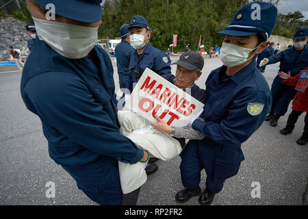 Henoko, Okinawa, Japan. 19th Feb, 2019. Police carry a man away from ...