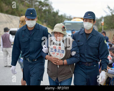 Henoko, Okinawa, Japan. 19th Feb, 2019. Police carry a man away from ...