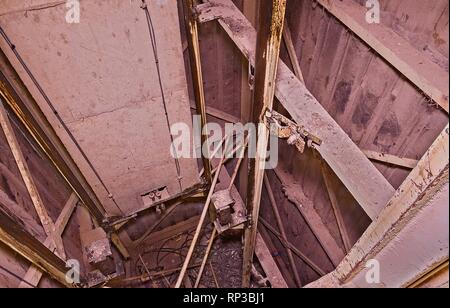 Old lift shaft with counterweight. Elevator reconstruction. Industrial ...