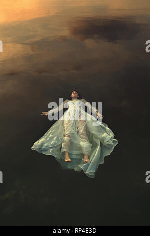 Floating dead woman in dark river . Ophelia conceptual Stock Photo - Alamy