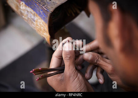 Workers in a diamond cutting workshop in Surat City, Gujarat. India ...