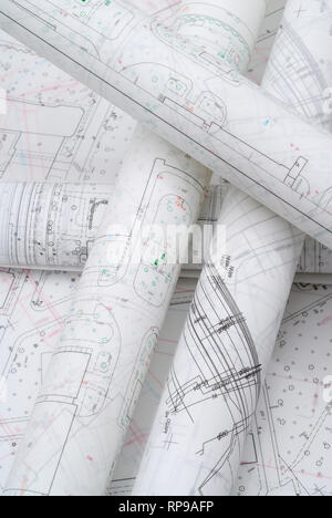 Rolled architectural plans lying on drawing board Stock Photo - Alamy