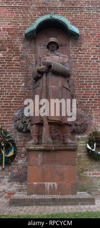 Statue of German soldier, commemorating First World War dead. Norden ...