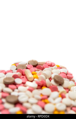 Photo of colored pills and tablets on a white background Stock Photo ...