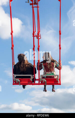 Giant red swing on top of the Adam Lookout sky deck high up in the air ...