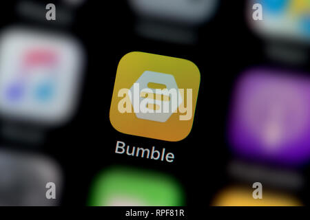 A close-up shot of the Bumble app icon, as seen on the screen of a ...
