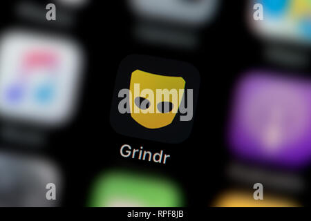 A close-up shot of the Grindr app icon, as seen on the screen of a ...