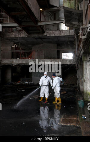 A cleaning team working inside one of the buildings known as the vele ...