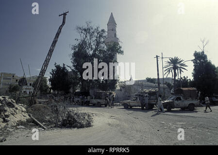 Somalis line the street in front of the gate of the Joint Task Force ...