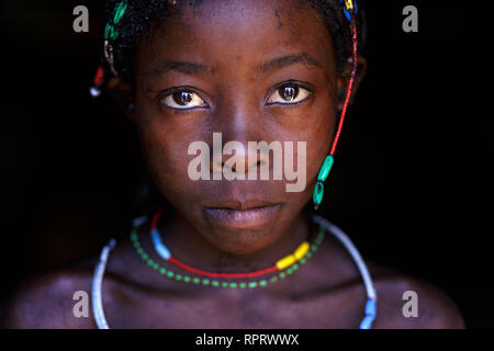 Portrait of a Hakaona (Zemba) girl with traditional ornaments and ...