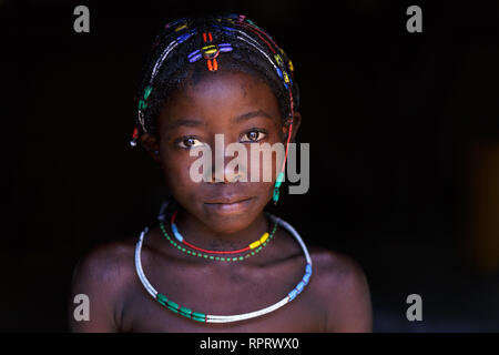 Portrait of a Hakaona (Zemba) girl with traditional ornaments and ...