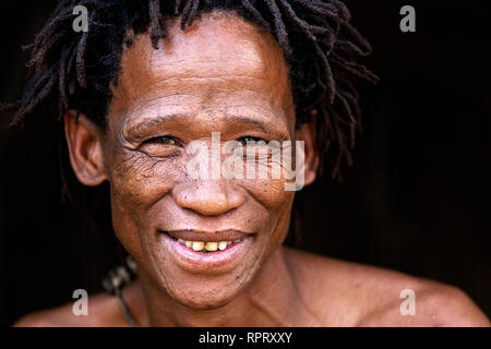 Bushman/San People. Male San hunters armed with traditional bow and ...
