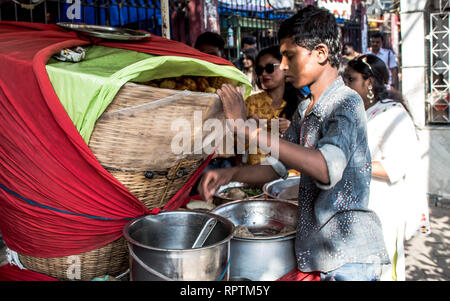 A street stall serving puchka or panipuri, semolina pastry filled with ...