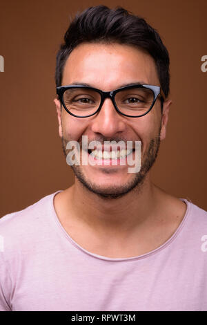 Handsome hispanic man with beard smiling happy and confident at the ...