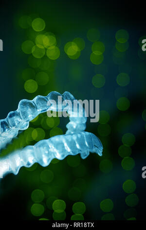 Woman hand holding denture alignment retainer Stock Photo - Alamy