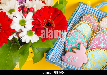 Beautiful bouquet of flowers and homemade gingerbread for celebration ...