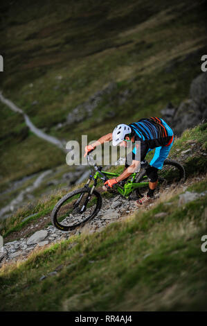 A mountain biker rides down the Rangers Path from the summit of Snowdon ...