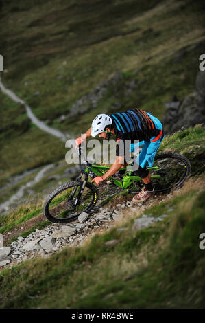 A mountain biker rides down the Rangers Path from the summit of Snowdon ...