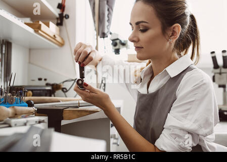 Shes got her business tools at hand. a young businesswoman sitting at ...
