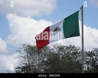 National maxican flag at Chichen Itza city near archaeological site in ...