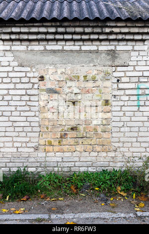 Old gungy white brick wall with bricked up window Stock Photo - Alamy