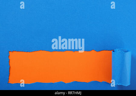 Torn blue paper strip orange background border frame Stock Photo - Alamy