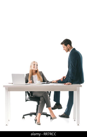 attractive businesswoman flirting with business colleague at workplace ...