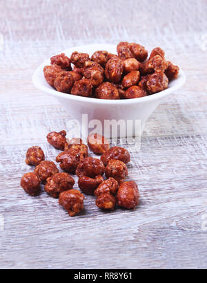 Hazelnuts, Pecans and walnuts, in a wooden box with compartments. Three ...