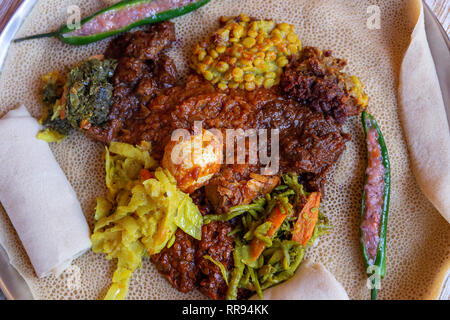 African food. Chicken, egg Doro Wat, berbere, lentils and Injera, the ...