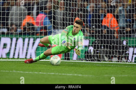 Chelsea goalkeeper Kepa Arrizabalaga makes a save with his legs during ...