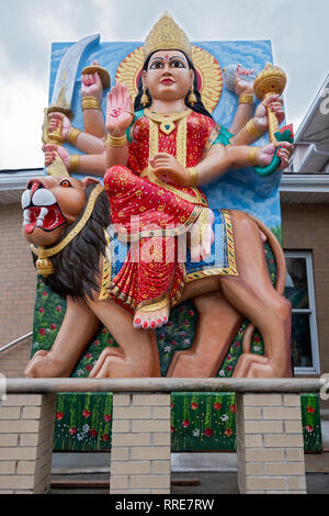 Large statue of the Hindu Goddess Durga chopping off the demon Mahisha ...