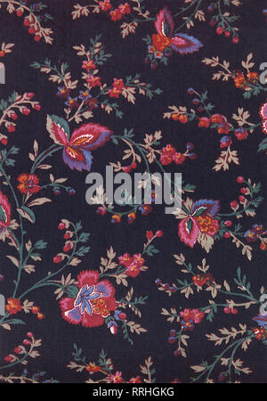 Red flowers on a background of green leaves in nature Stock Photo - Alamy