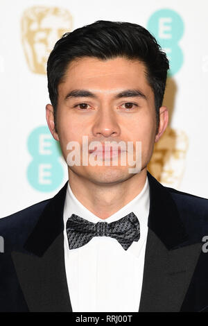 Henry Golding attends the EE British Academy Film Awards at The Royal ...