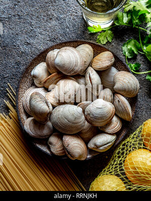 Ingredients for preparation spaghetti with clams - raw fresh clams ...