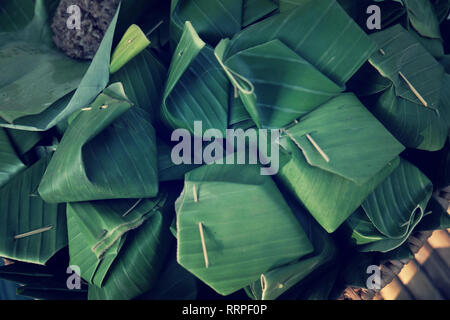 Banana leaf wrapped rice, thai food Stock Photo - Alamy