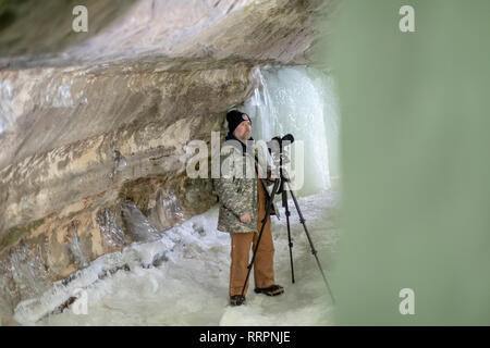 Eben Junction, Michigan - A photographer inside the Eben Ice Caves ...