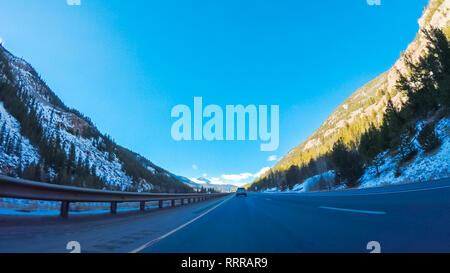 Drivign West on interstate highway I70 through the mountains Stock ...