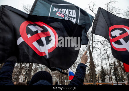 Black flags with crossed out of communist symbols of the supporters of ...