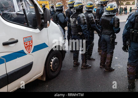 CRS police officers securing the zone in frong of the Yellow vests ...