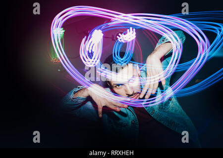 Handsome bearded man dancing in spotlight Stock Photo - Alamy