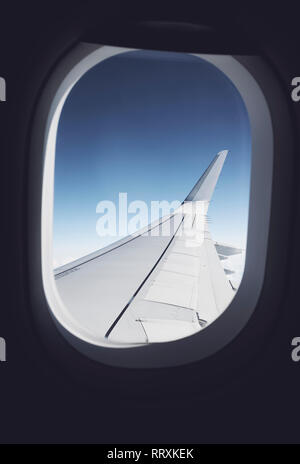 airplane wing through the airplane window Stock Photo - Alamy