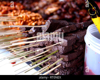 Close up photo of a Filipino street food called Bopis or chopped beef ...